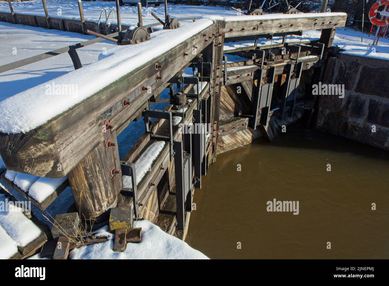 Gates of closed canal lock in winter covered by snow at Struka, Finland ...