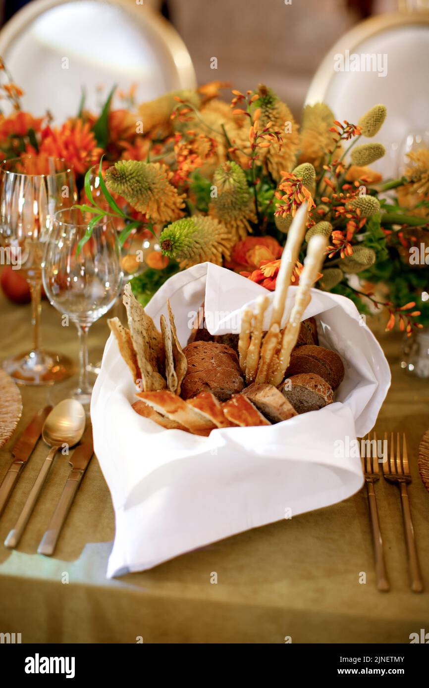 Different types of bread on the wedding table Stock Photo - Alamy