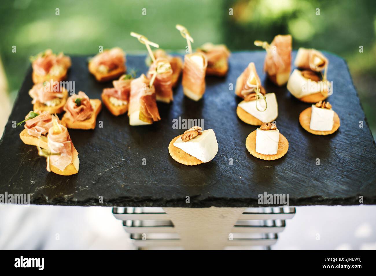 Rows of appetizers and starters on the wedding table Stock Photo - Alamy