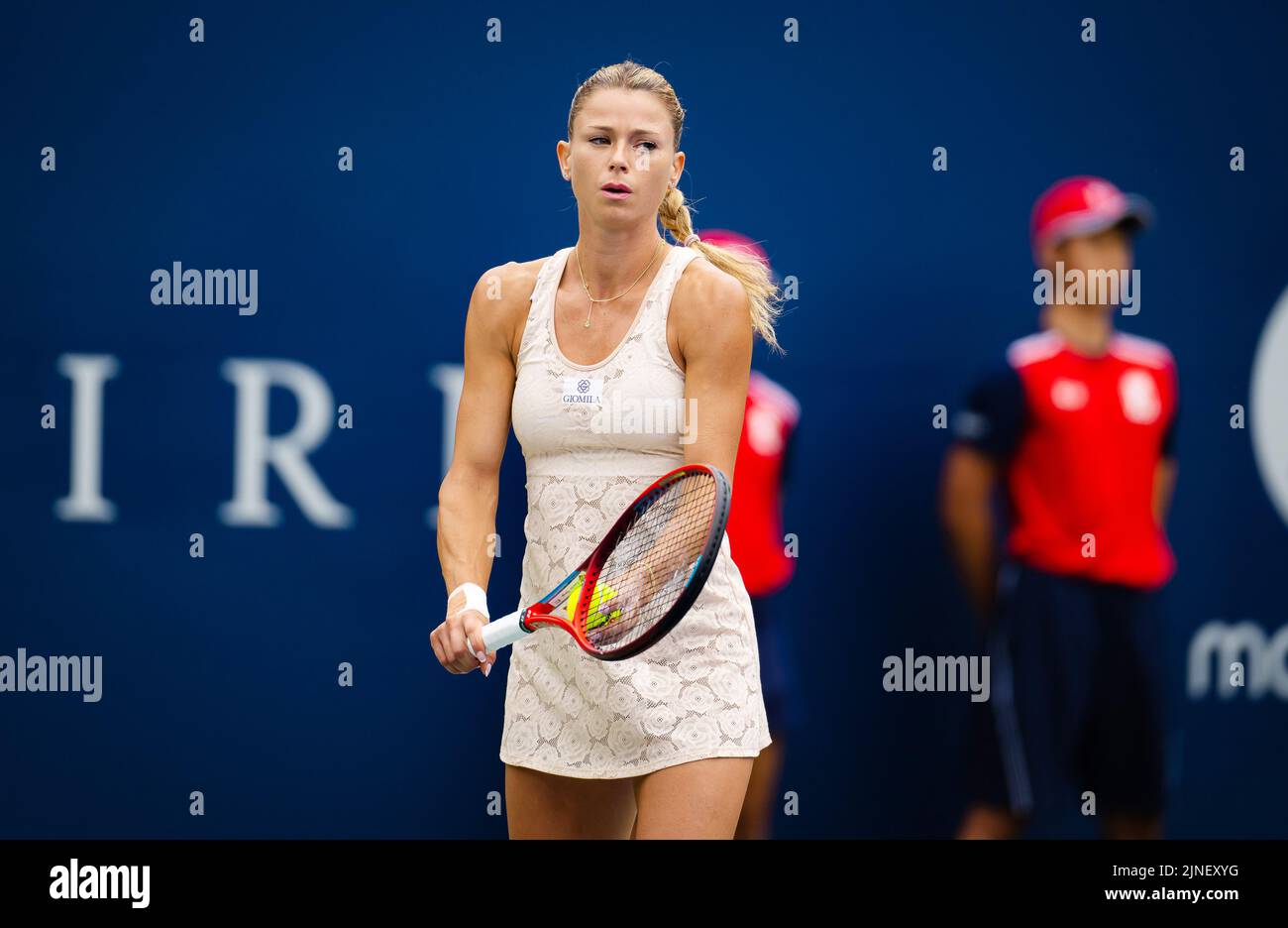 Camila Giorgi of Italy in action against Emma Raducanu of Great Britain ...