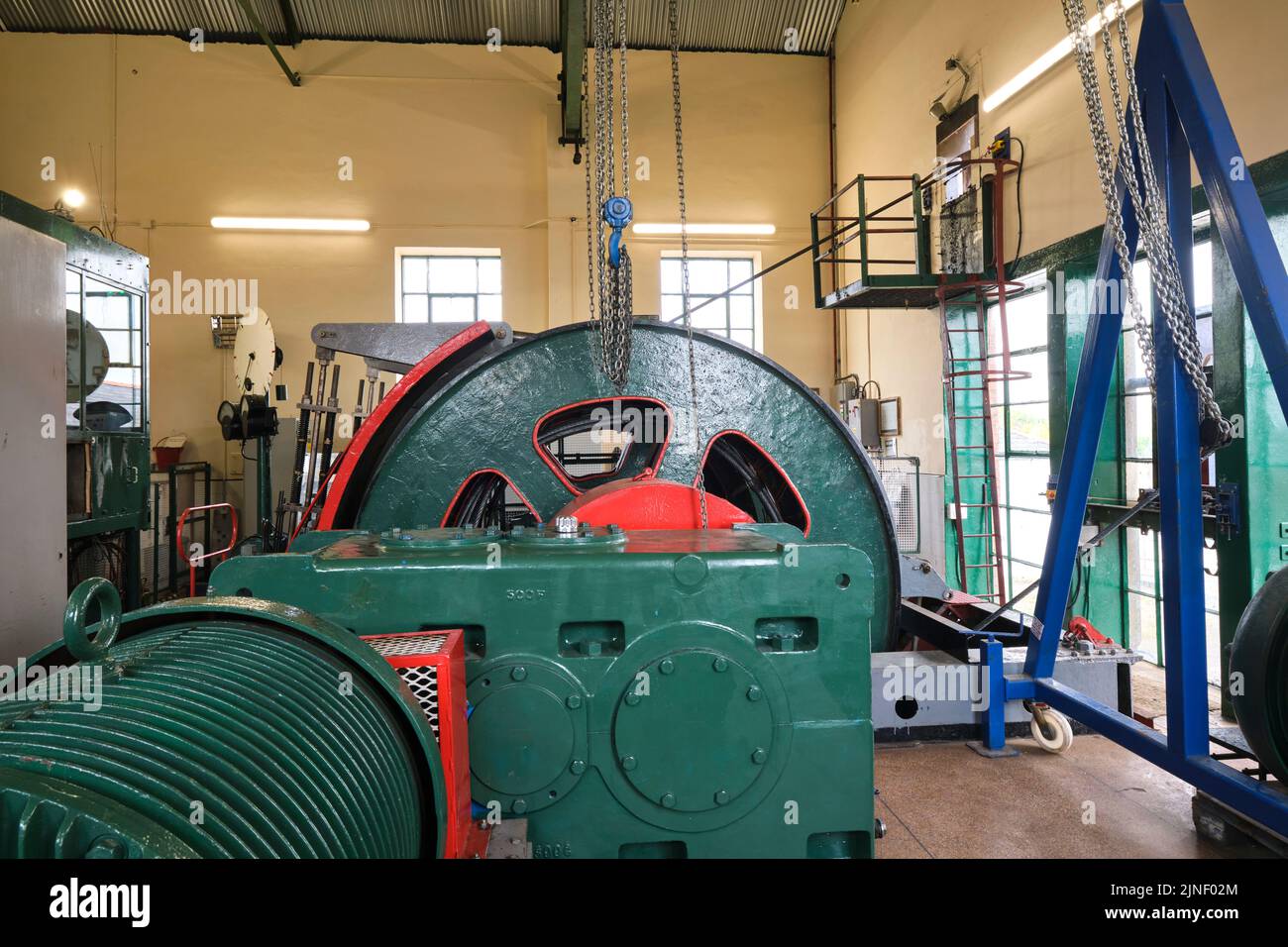 The wheel house that runs the cable for the winding tower elevator of ...