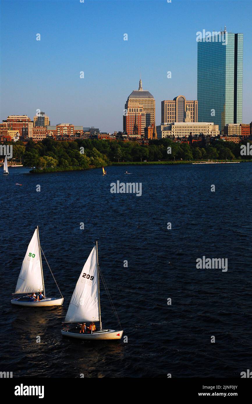 Two sailboats ply the waters of the Charles River from Community ...