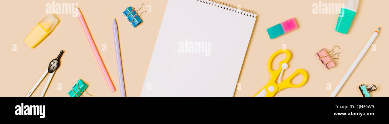 Neutral pastel beige background and school supplies, stationery ...