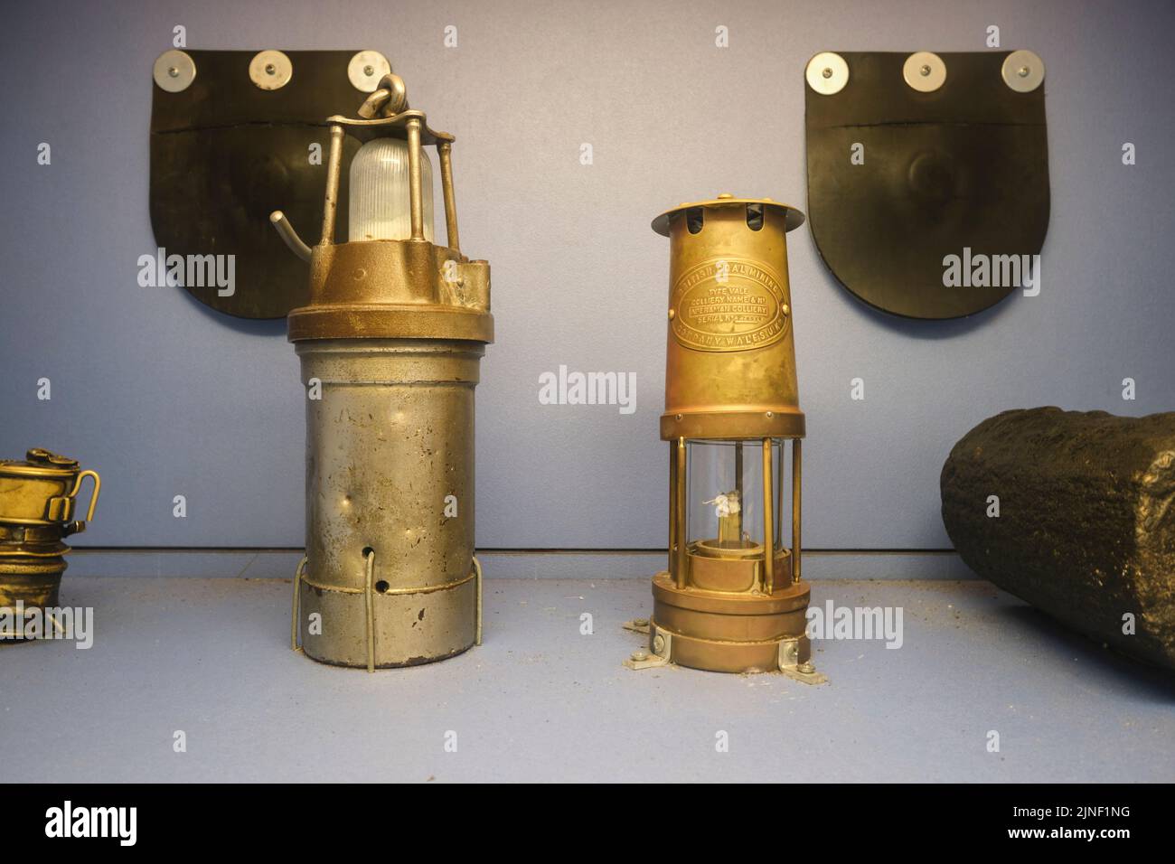 A display of metal, brass, old safety lanterns, lights used in the mine ...