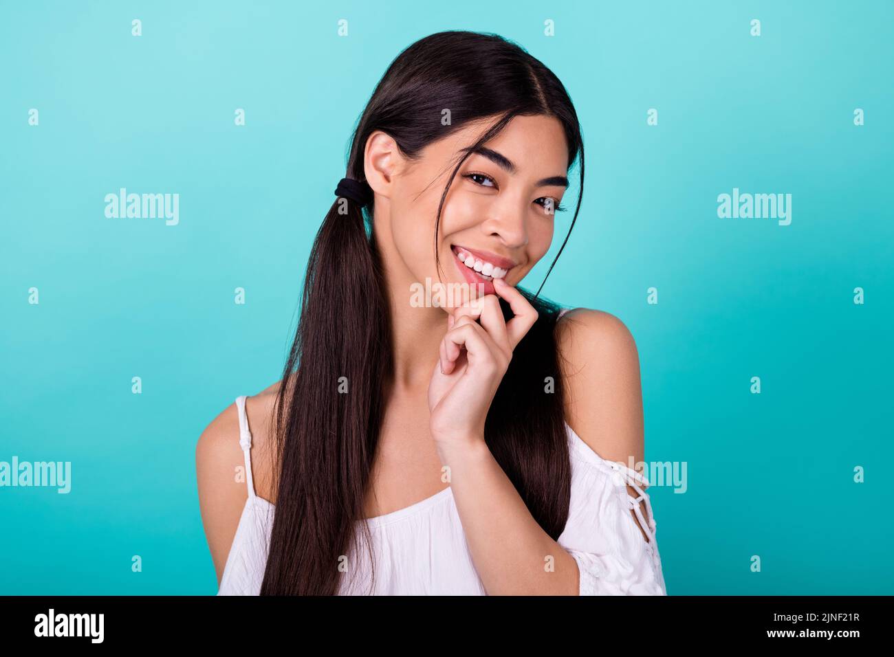 Photo of adorable shiny girl dressed off shoulders blouse finger mouth ...