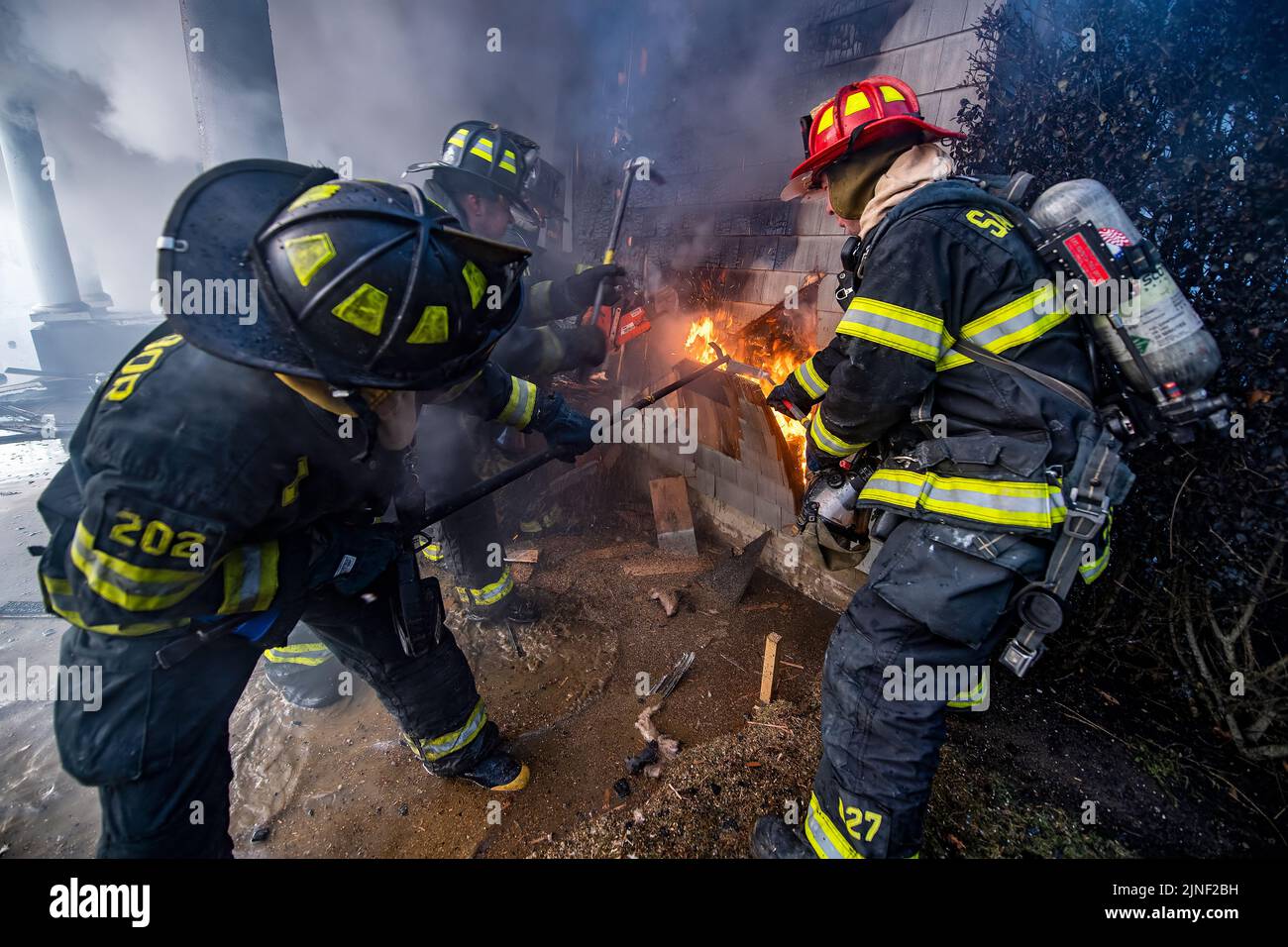 Sag Harbor firefighters use a chain saw, a hook and Halligan tools to ...
