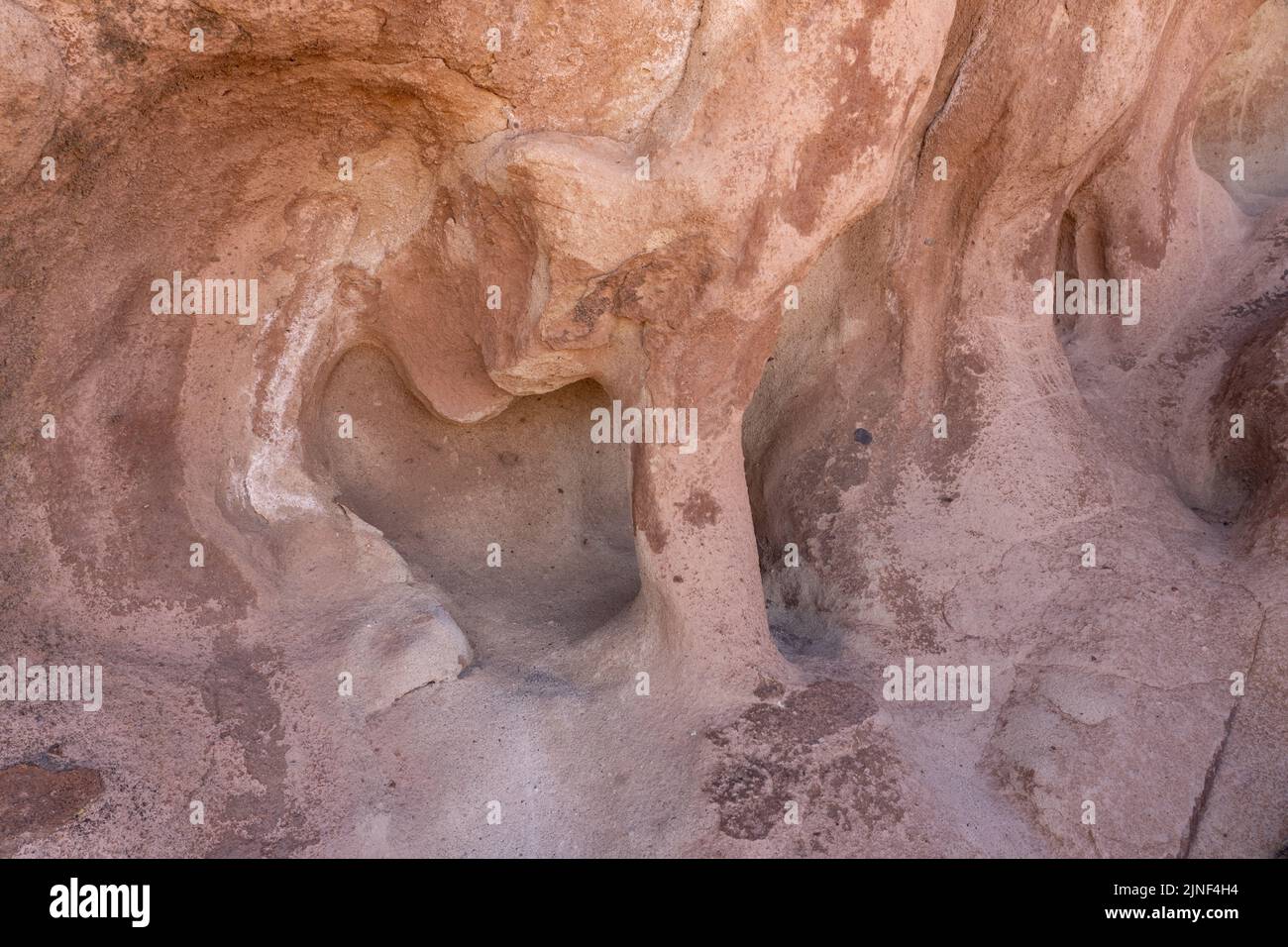 A natural mini arch in the rock at the Yerbas Buenas Petroglyph Site in ...