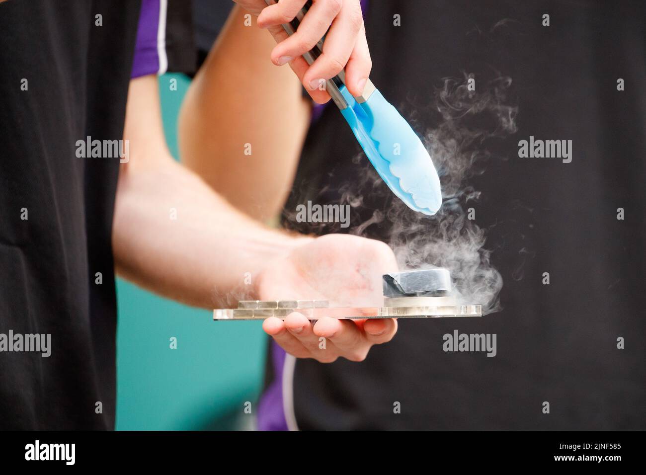 Members of the University of Queensland's Science Demo Troupe present ...