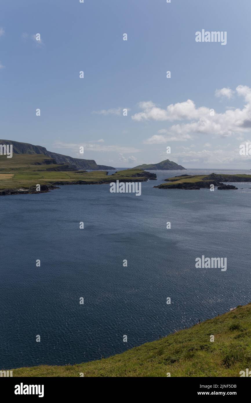 A vertical shot of a sea and islets in Ireland Stock Photo - Alamy