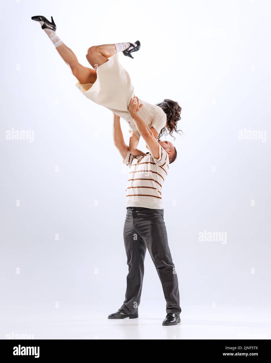 Dynamic portrait of emotional man and woman dancing sport dances ...