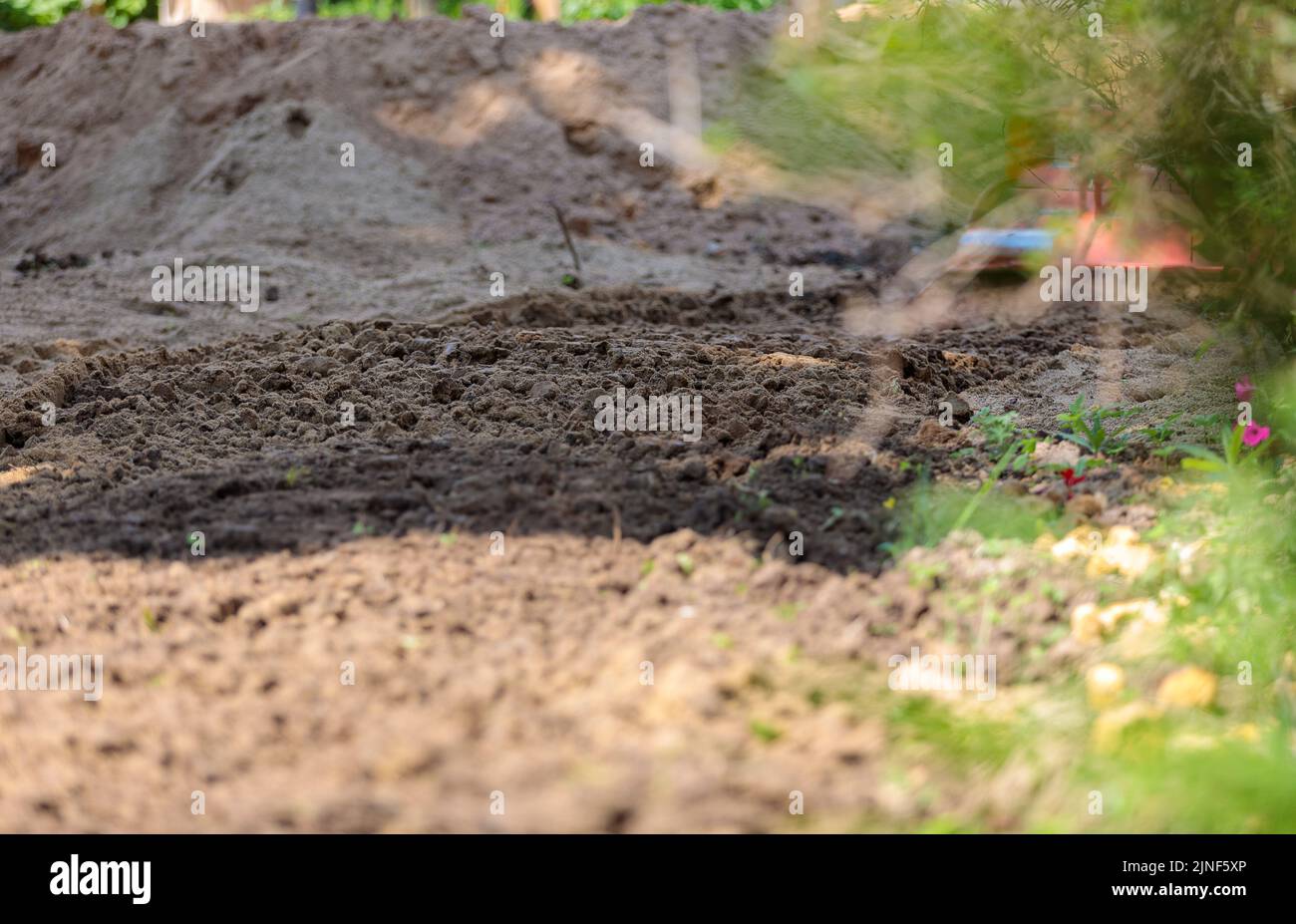 Leveling soil hi-res stock photography and images - Alamy