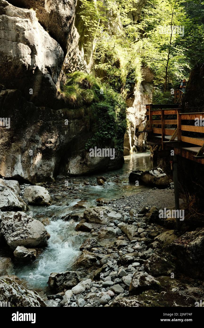 A vertical shot of the river flowing between rocks. Seisenbergklamm ...