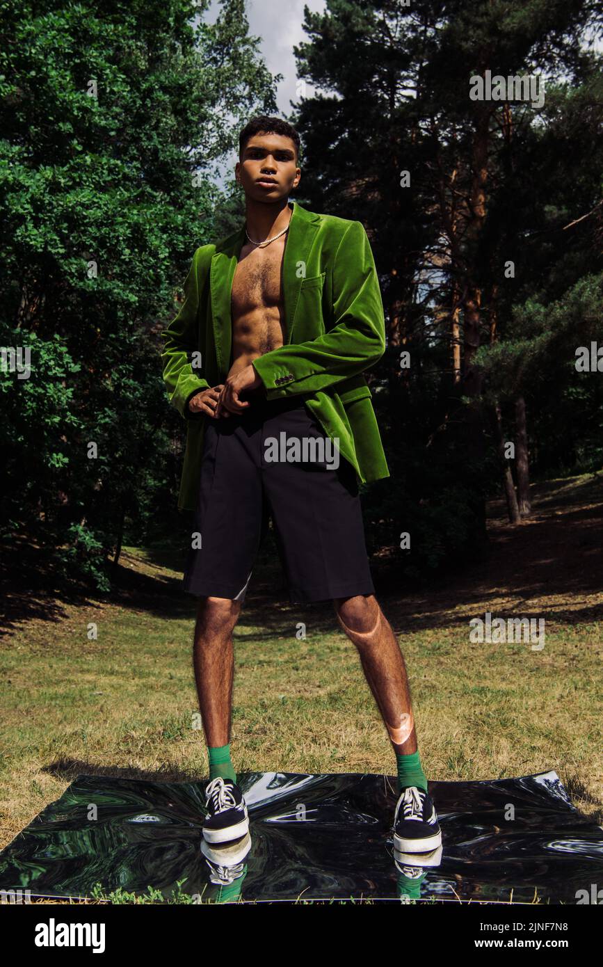 Black man shorts standing hi-res stock photography and images - Alamy