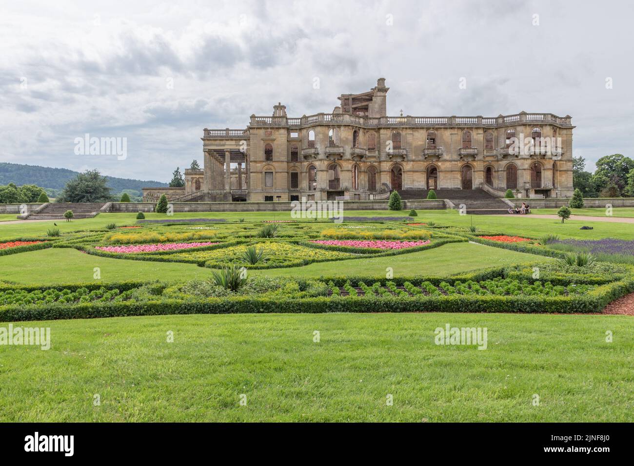 A scenic view of the Witley Court and well-groomed garden in ...