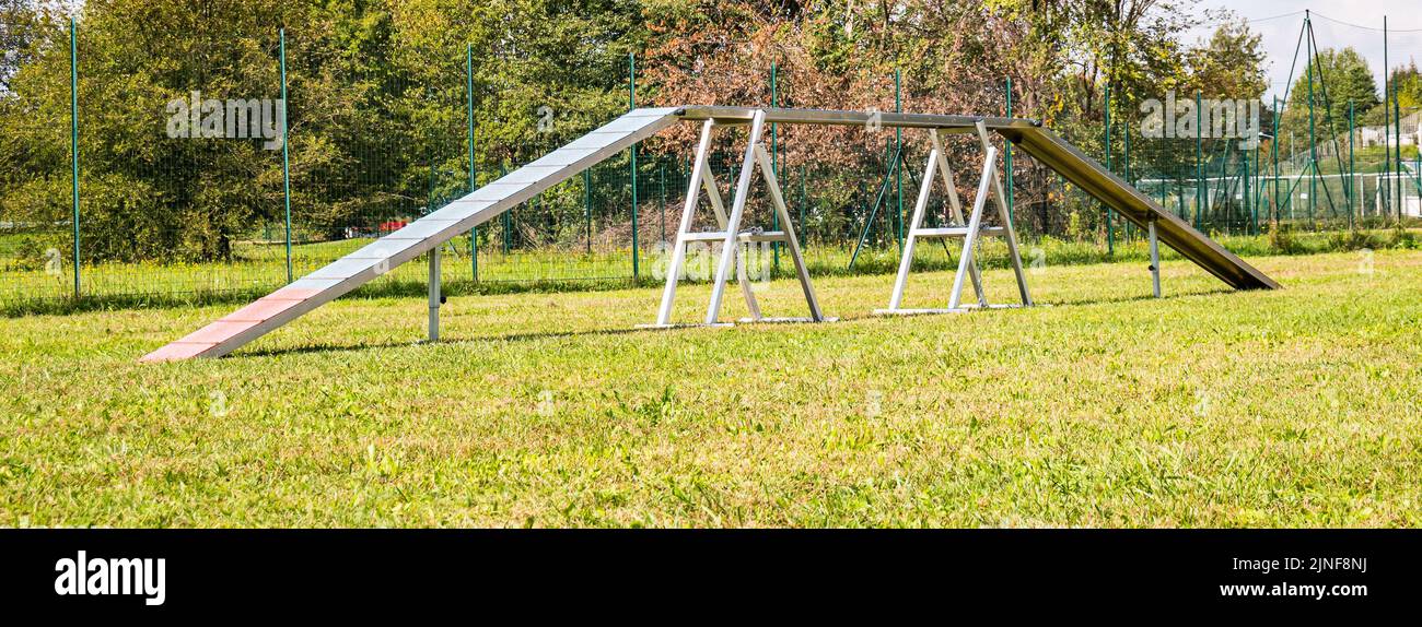 Area equipped for dog training. Dog training in a fenced area. Obstacle ...
