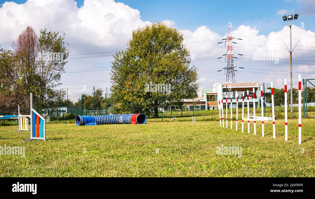 Area equipped for dog training. Dog training in a fenced area. Obstacle ...