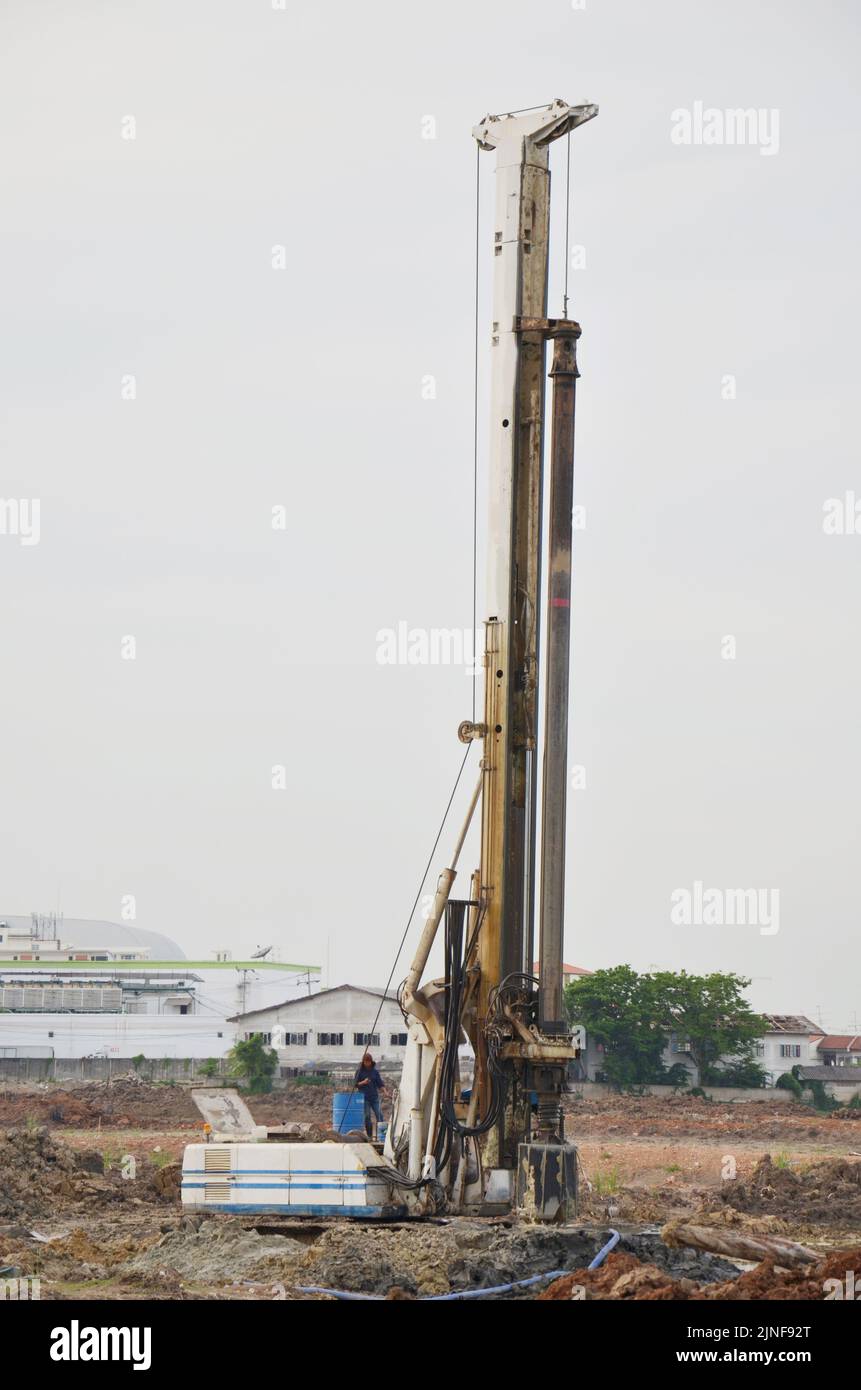 Asian labor people and thai labour workers use machine and heavy ...
