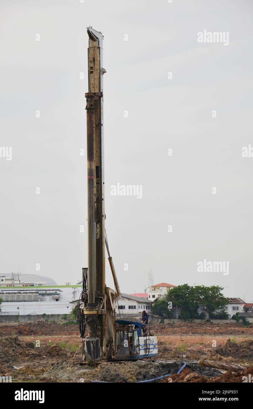 Asian labor people and thai labour workers use machine and heavy ...