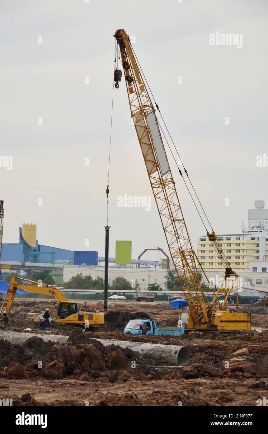 Asian labor people and thai labour worker use machine and heavy ...