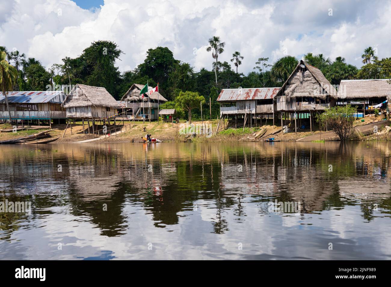 Shacks on stilts are generally the accepted housing in the Peruvian ...