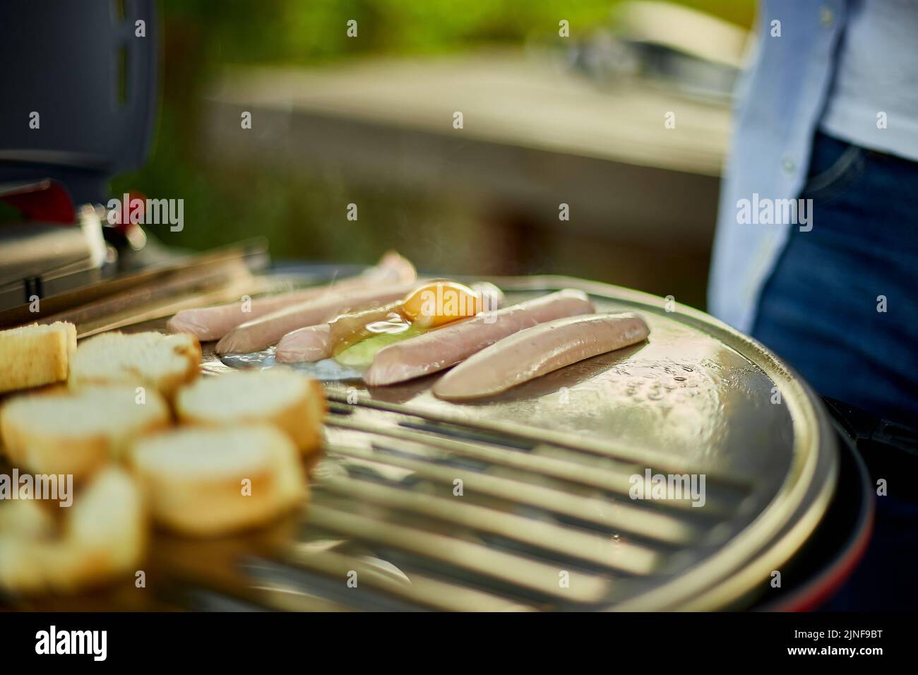 Prepare breakfast roasting bruschetta on the barbecue gas grill outdoor ...