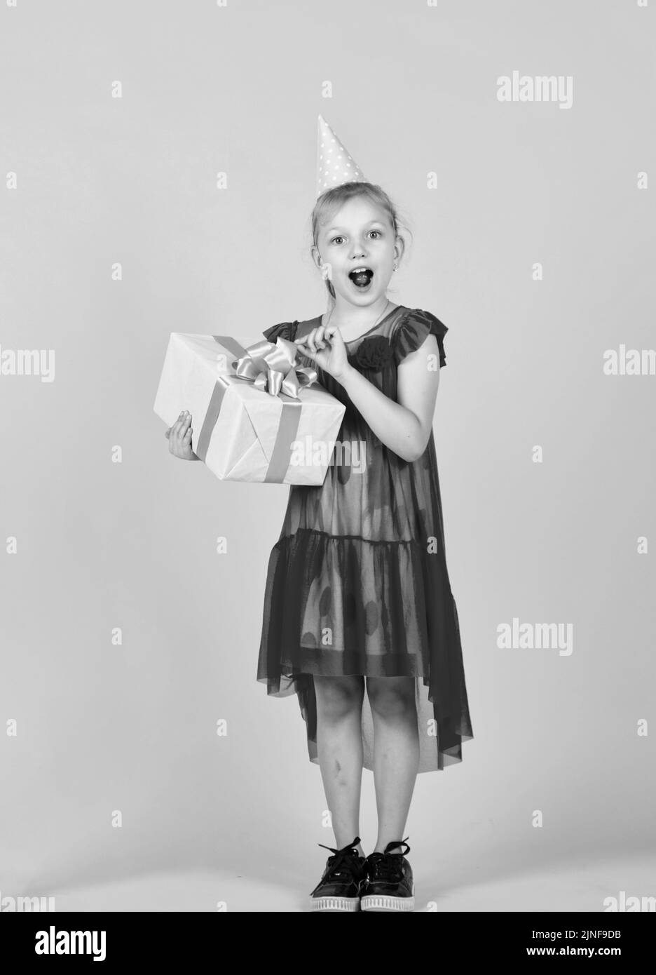 big surprise. kid holding gift package. holiday preparation and celebration childhood happiness ...