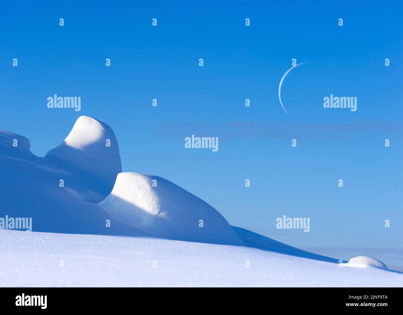 Snowy winter arctic landscape, crescent moon in the blue sky Stock ...