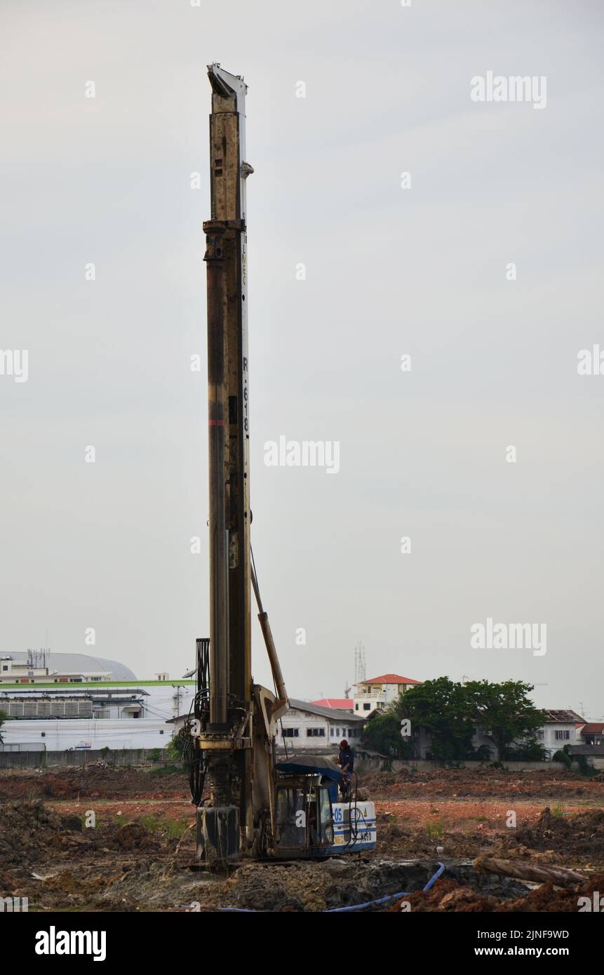 Asian labor people and thai labour workers use machine and heavy ...