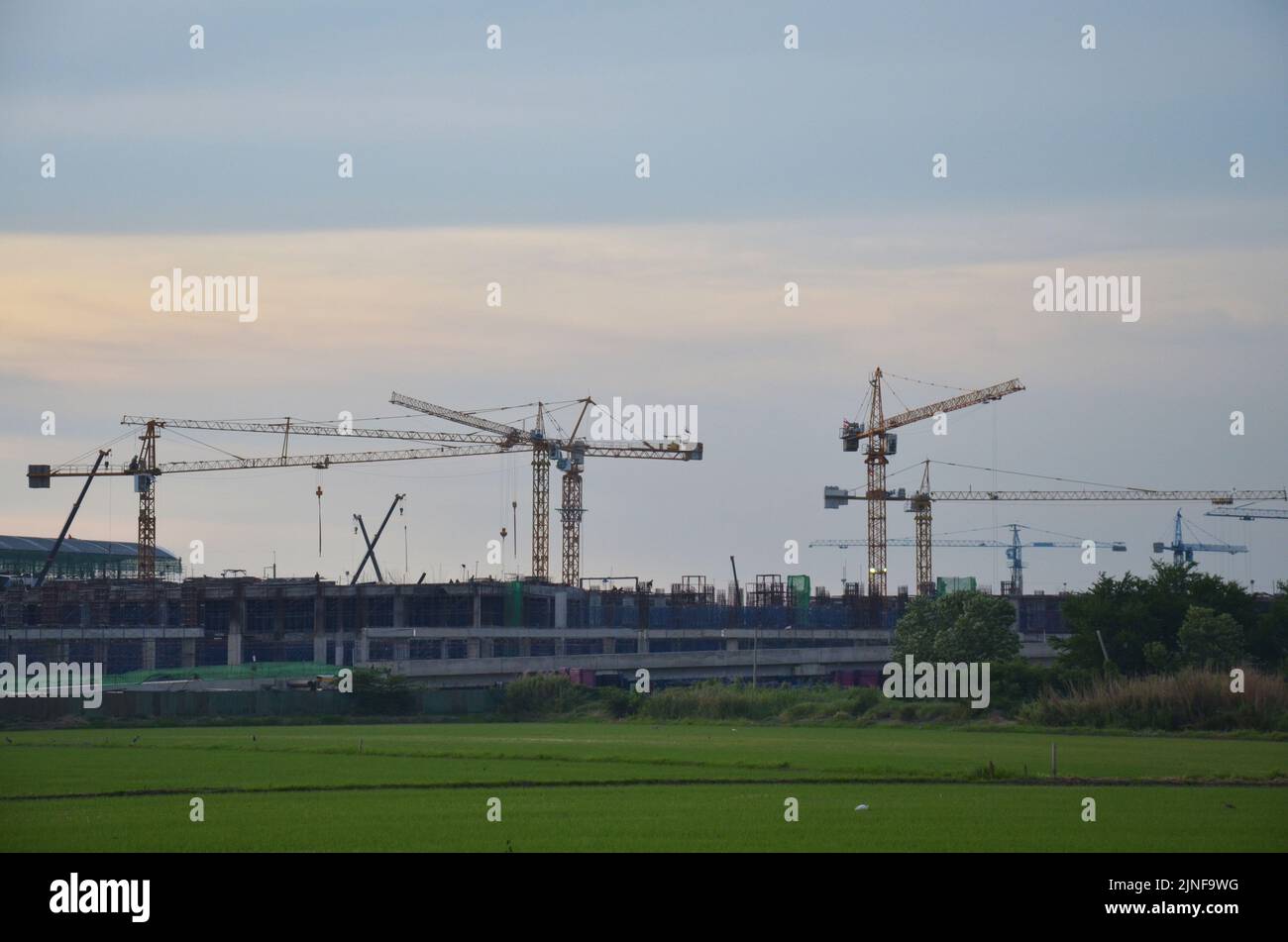 Asian labor people and thai labour worker use machine and heavy ...