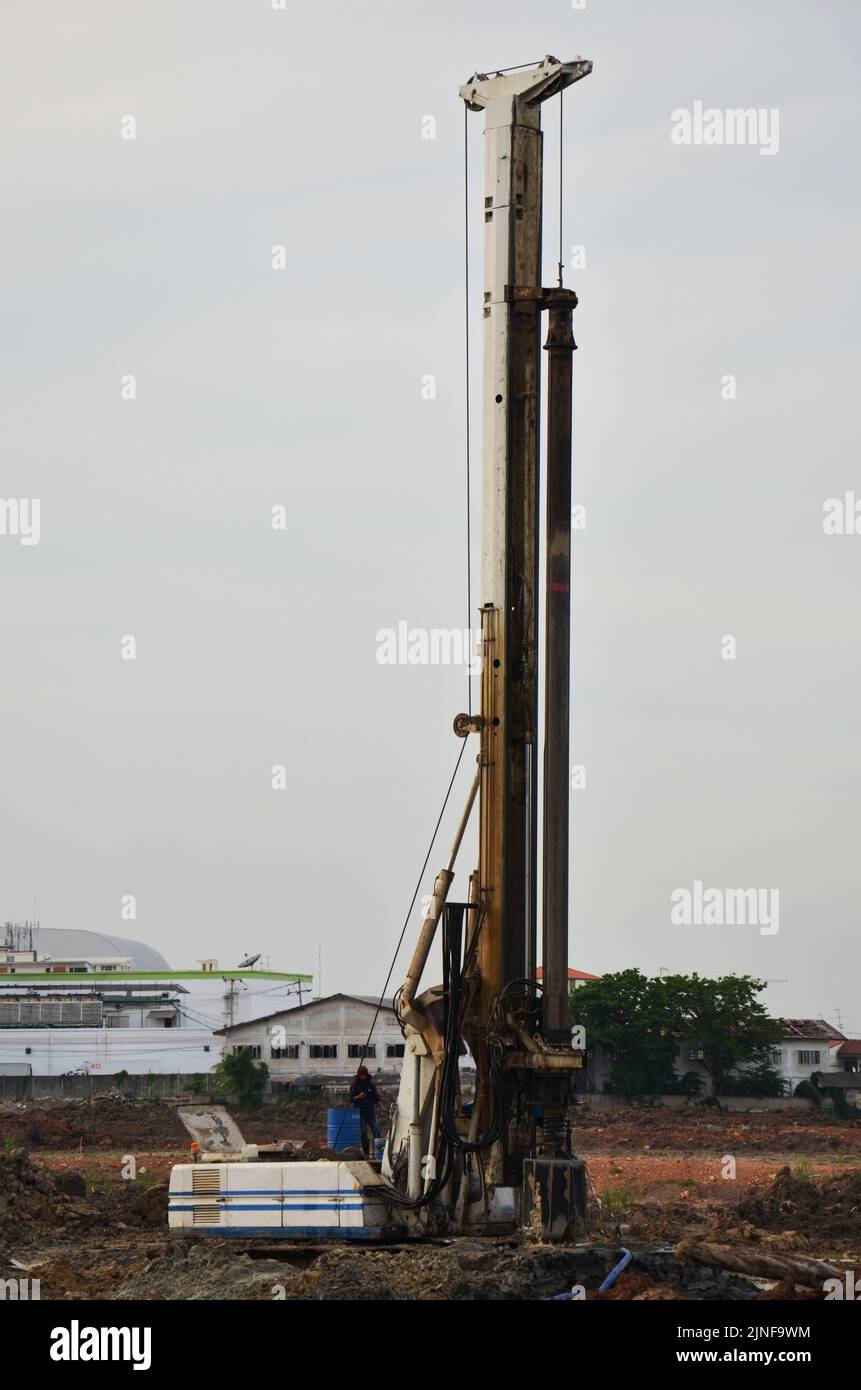 Asian labor people and thai labour workers use machine and heavy ...