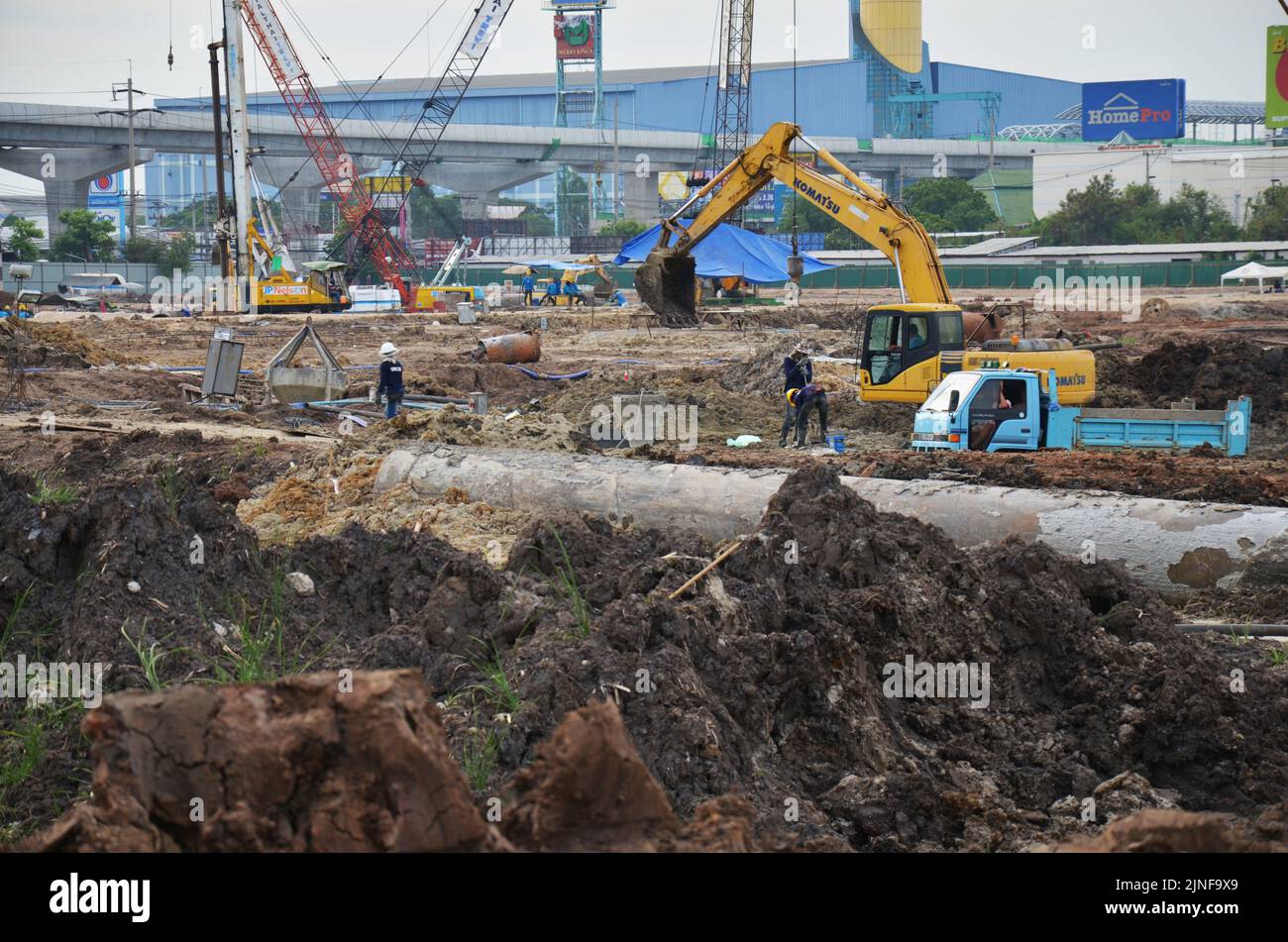 Asian labor people and thai labour workers use machine and heavy ...