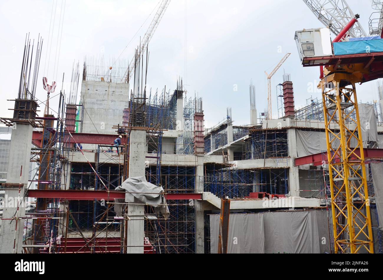 Asian labor people and thai labour worker use machine and heavy ...