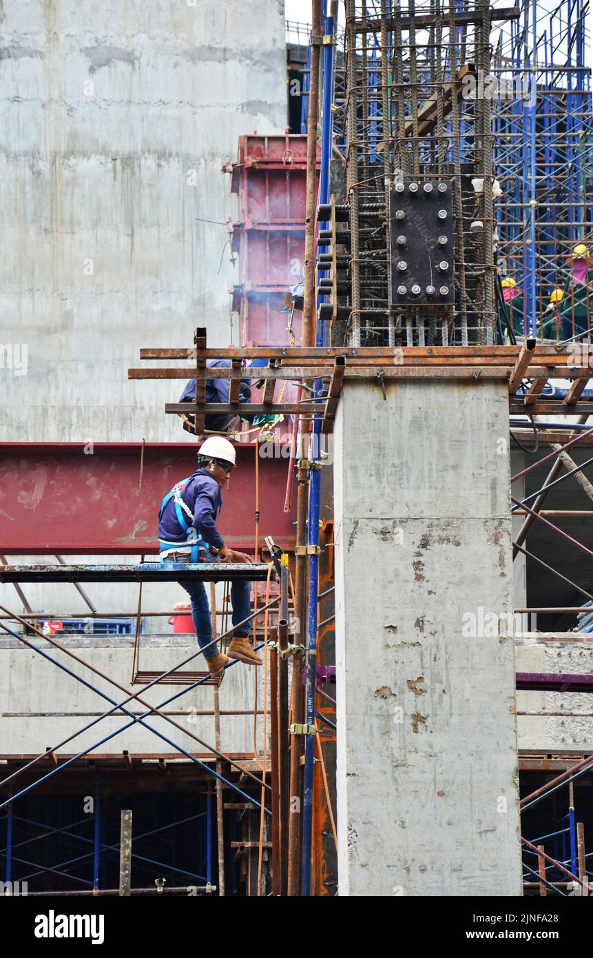 Asian labor people and thai labour worker use machine and heavy ...