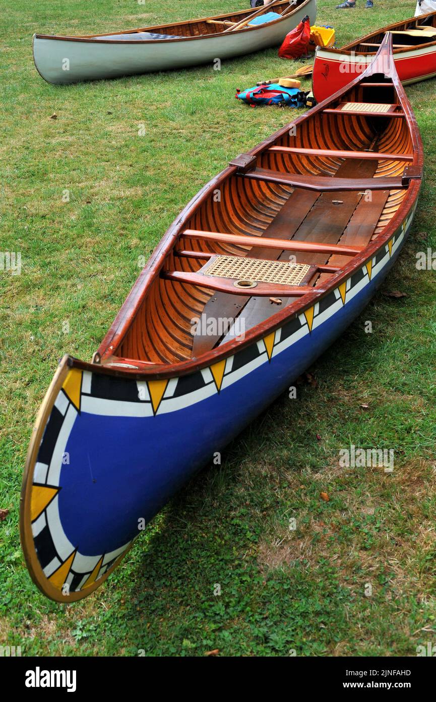 An Old Town wood canvas canoe ready for a paddle after a restoration painted with original ...