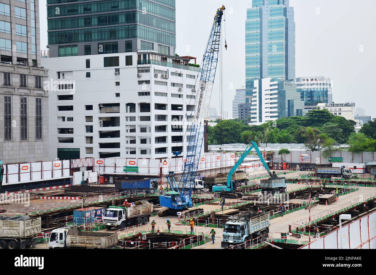 Asian labor people and thai labour worker use machine and heavy ...