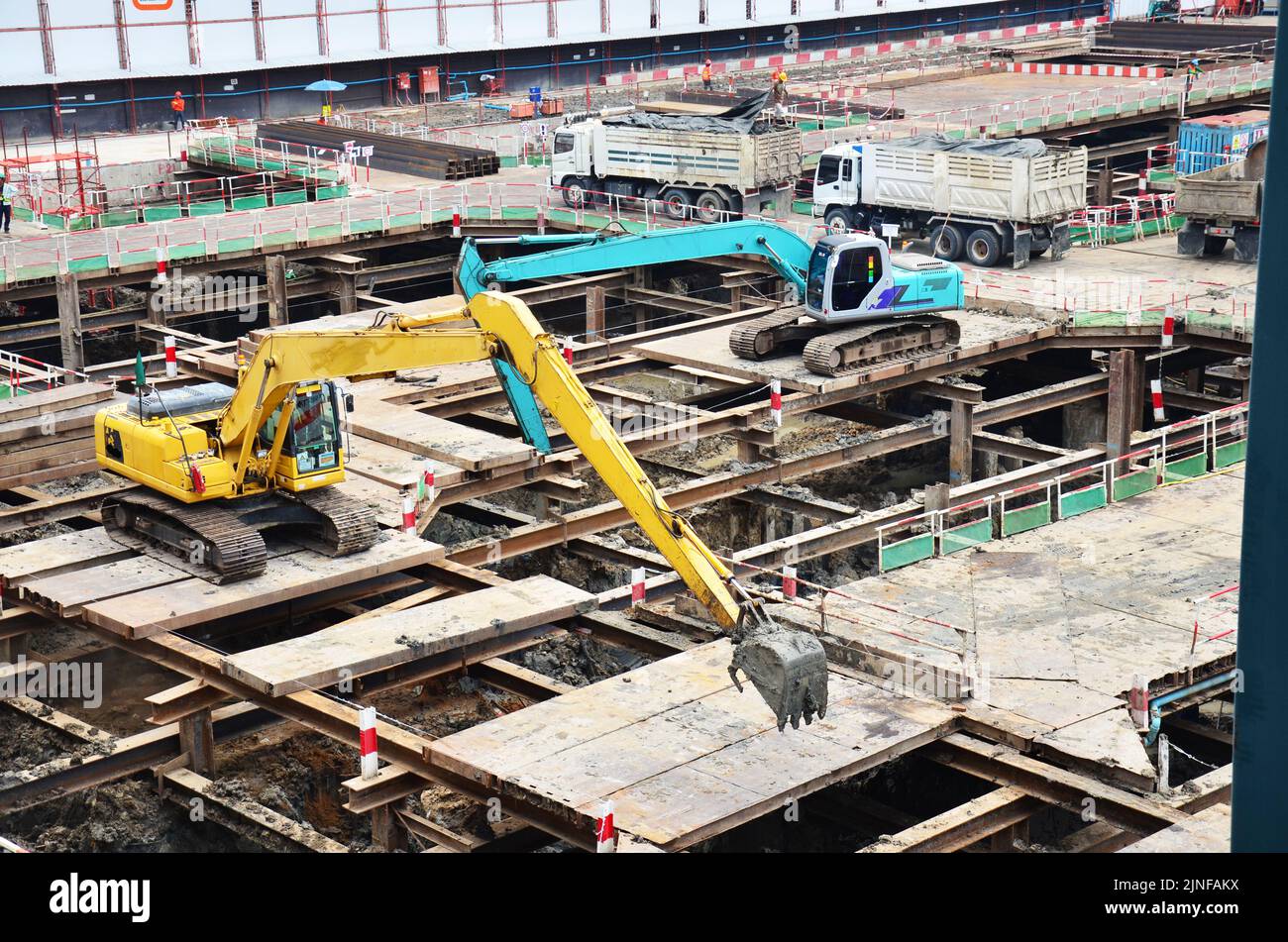 Asian labor people and thai labour worker use machine and heavy ...