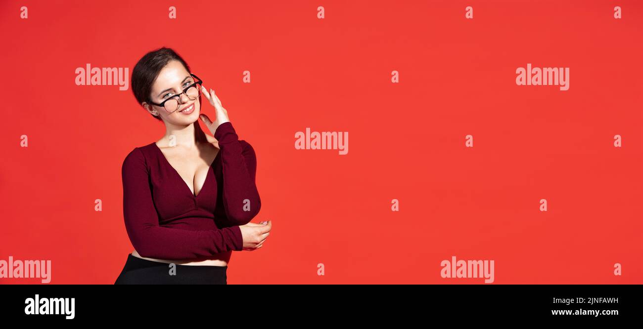 Portrait of beautiful young woman in official clothes and glasses ...