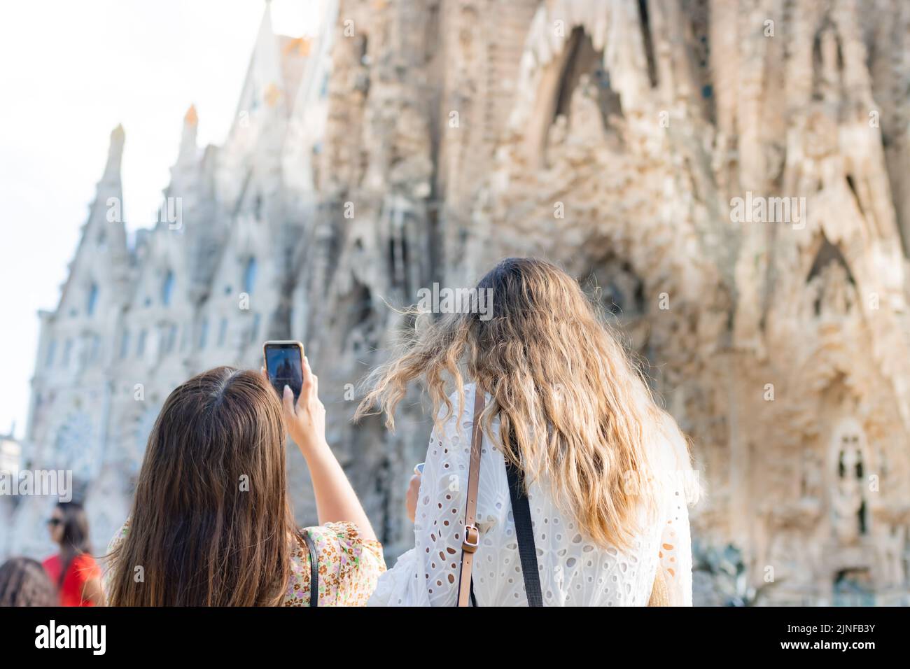 Barcelona, Spain - July 1, 2022: two girls on vacation in front of the ...