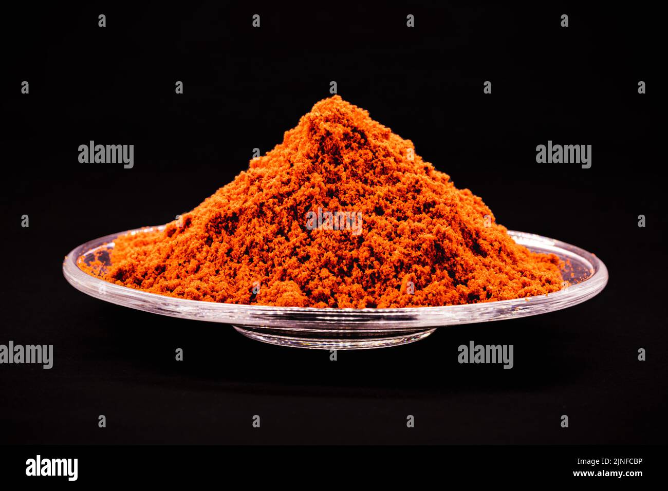 red pigment powder, blood red, with black background, industrial use in ...
