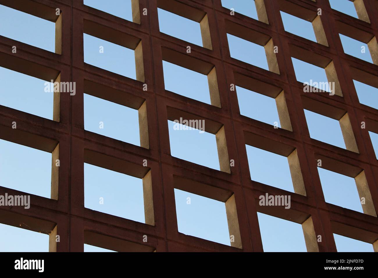 Square patterned concrete stone wall texture, background or wallpaper ...