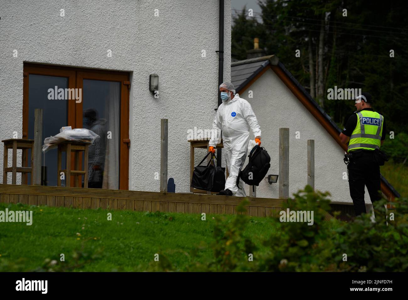 Forensics officers at the scene of an incident at a property in the ...