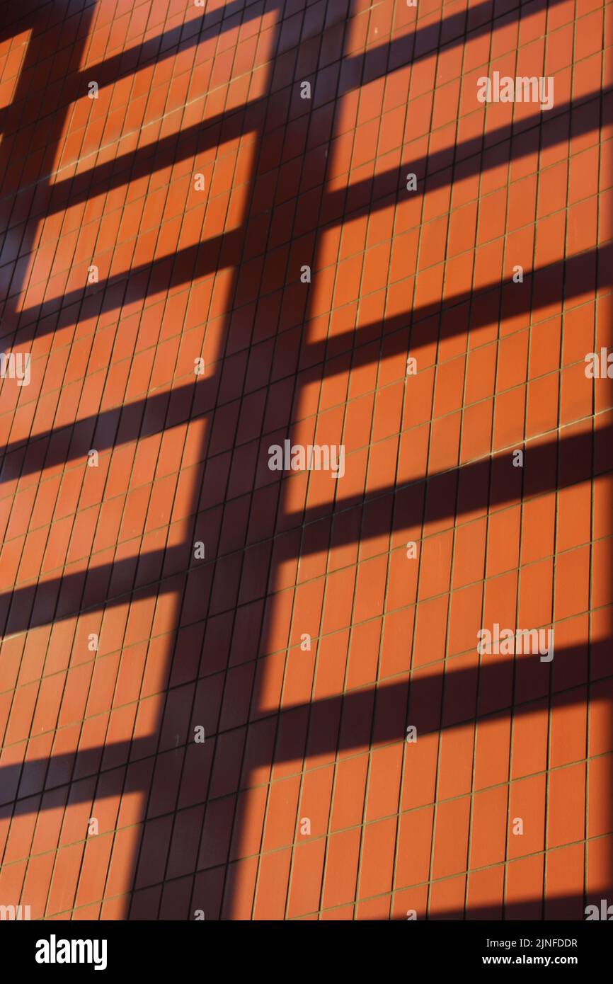 Red brick with grided shadow on top. Background wallpaper concept for ...