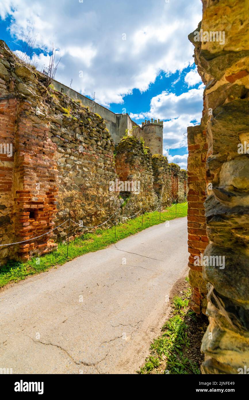 Ruins of Boskovice castle - view of surrounding walls and tower. Summer ...