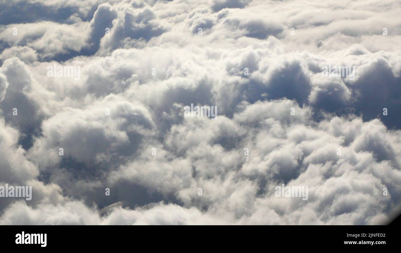 Flying through beautiful thick fluffy clouds. Soft white clouds moving ...