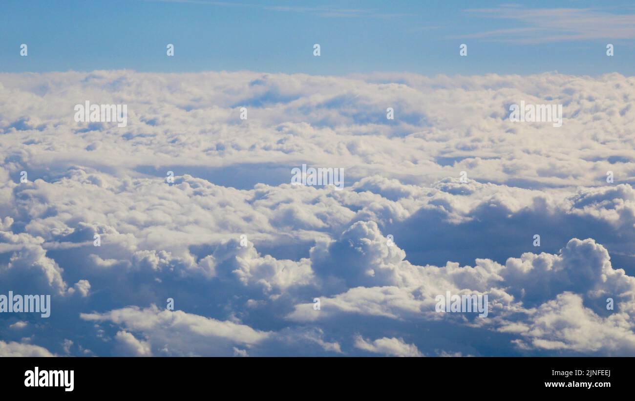 Flying through beautiful thick fluffy clouds. Soft white clouds moving ...