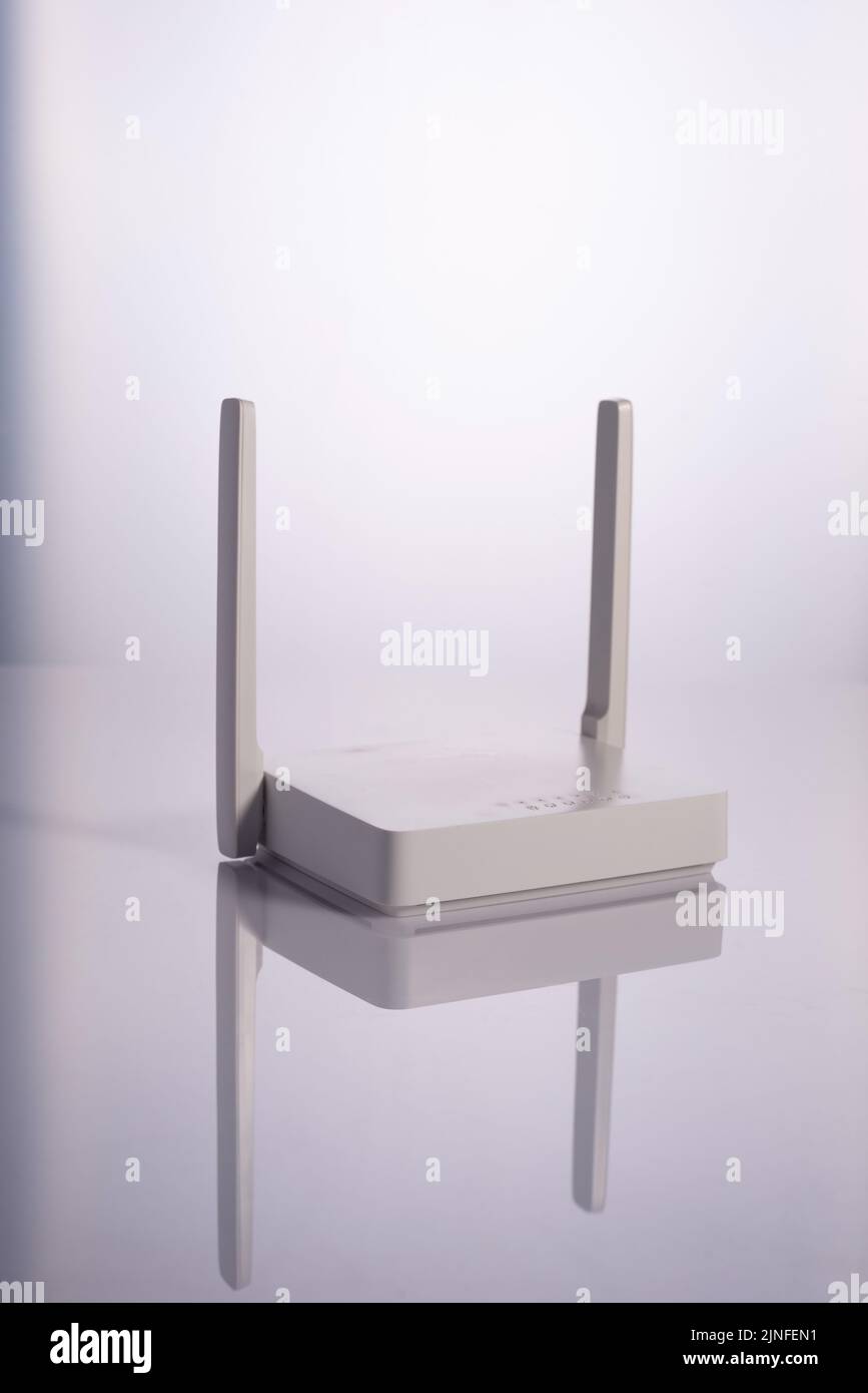 white wi-fi router on a white background Stock Photo - Alamy