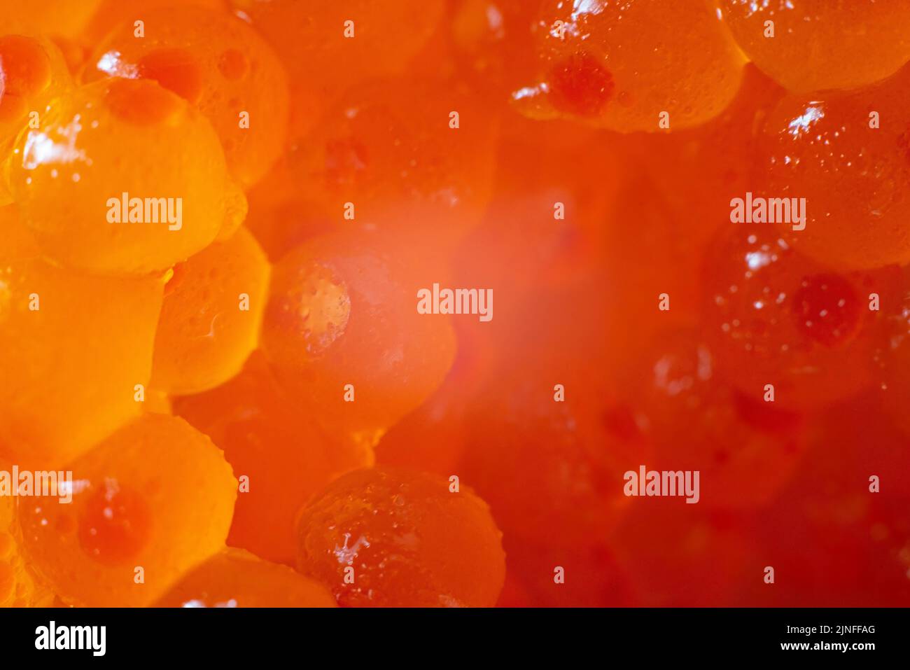 Fresh red caviar on whole background, close up Stock Photo - Alamy