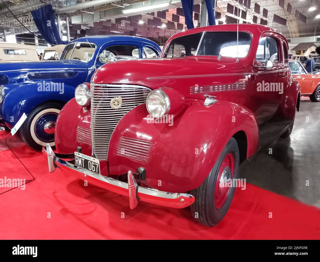 Old red 1939 Chevrolet Chevy Master coupe by GM. Exhibit hall. Front ...