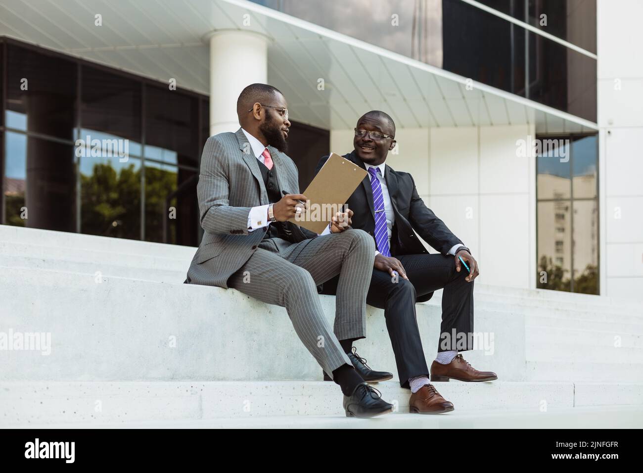 Professional couple suits hi-res stock photography and images - Alamy