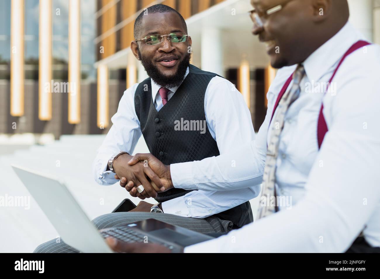 Two men at table in suits hi-res stock photography and images - Alamy